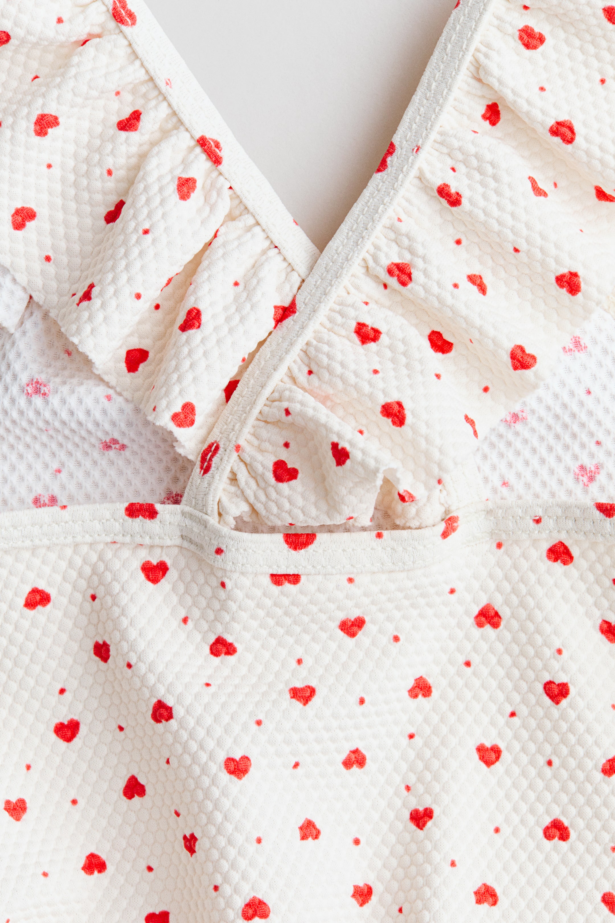 Flounce-trimmed swimsuit - Light beige/Hearts - Kids | H&M MY
