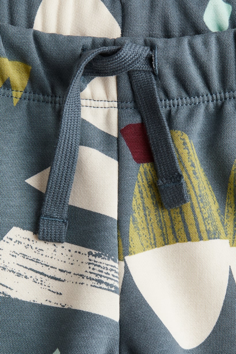 Dark turquoise/patterned Printed Joggers for kids | H&M US
