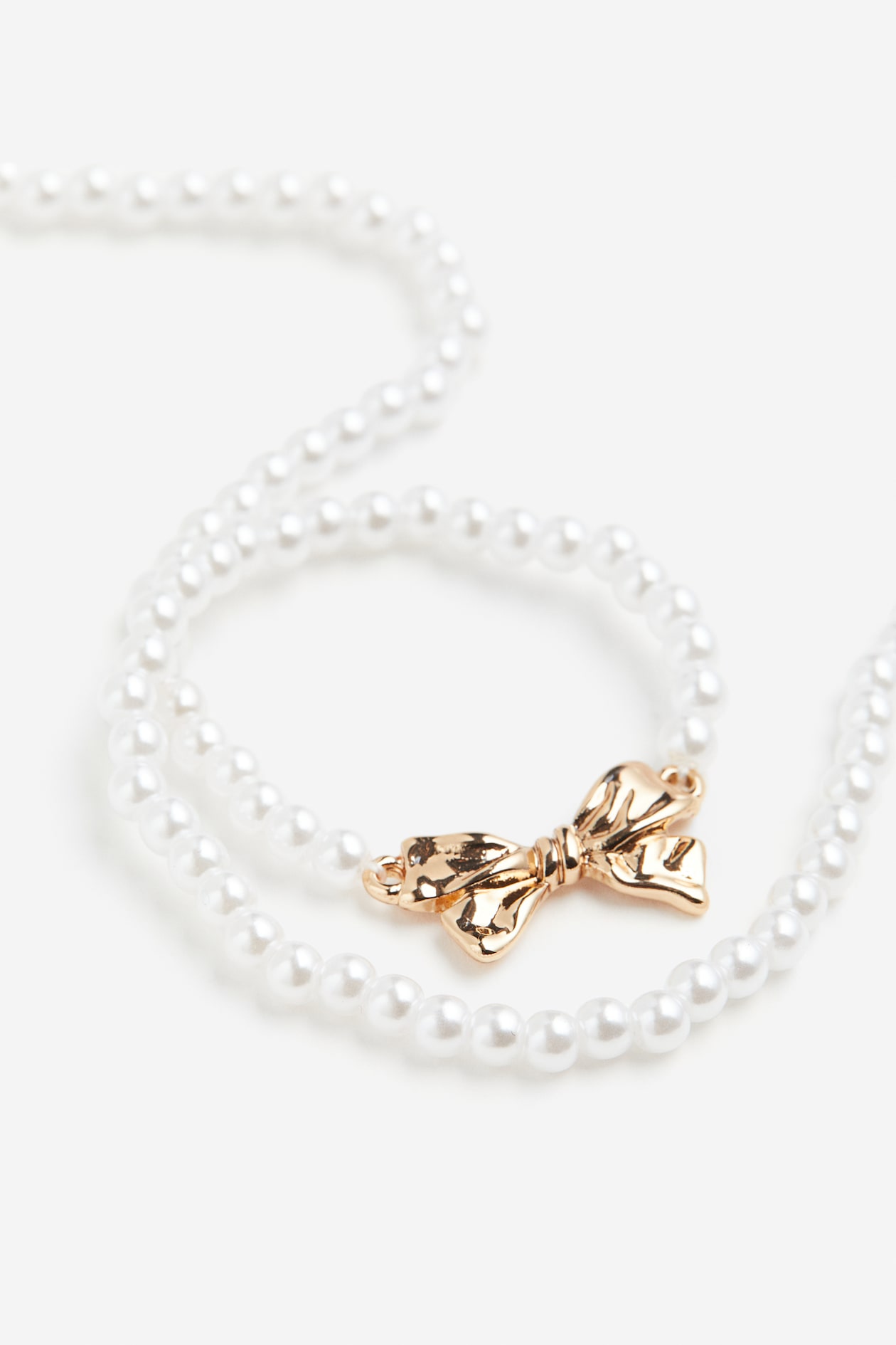 Collier avec pendentif - Blanc/nœud - FEMME | H&M FR