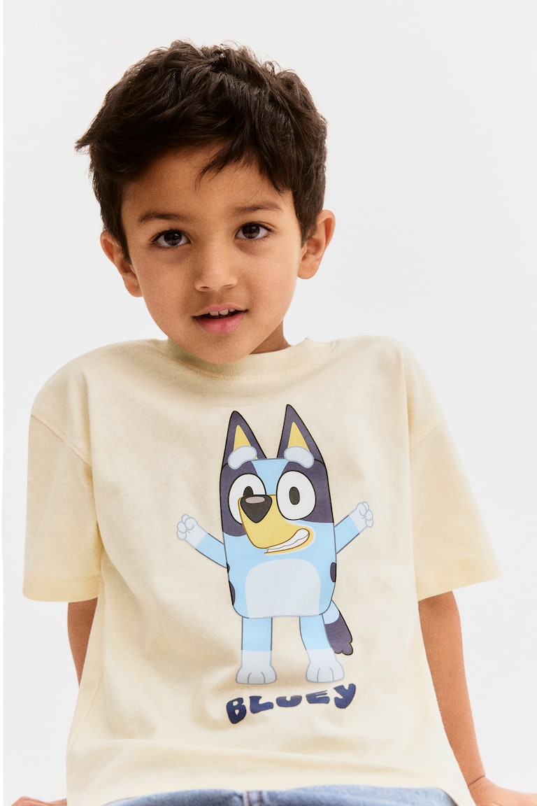 Oversized Printed T-Shirt - Light yellow/Bluey - Kids | H&M US