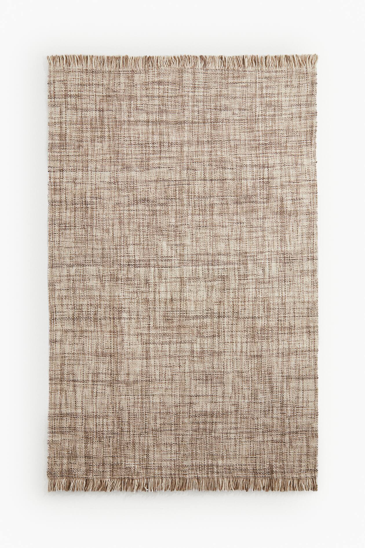 Beige Fringed wool-blend rug at H&M Home | H&M GB