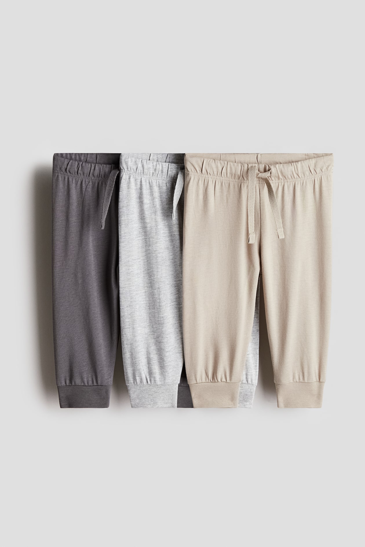 Pack de 3 joggers en punto de algodón - Beige claro/Gris - NIÑOS | H&M ES
