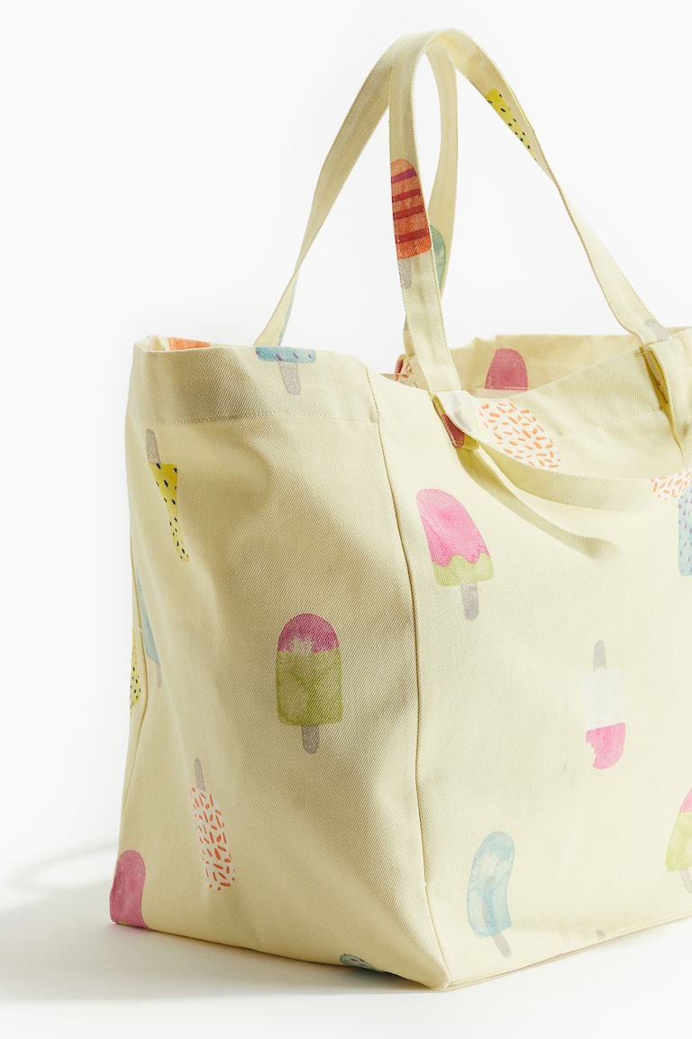 Light yellow/ice cream Patterned Beach Bag at H&M Home | H&M US
