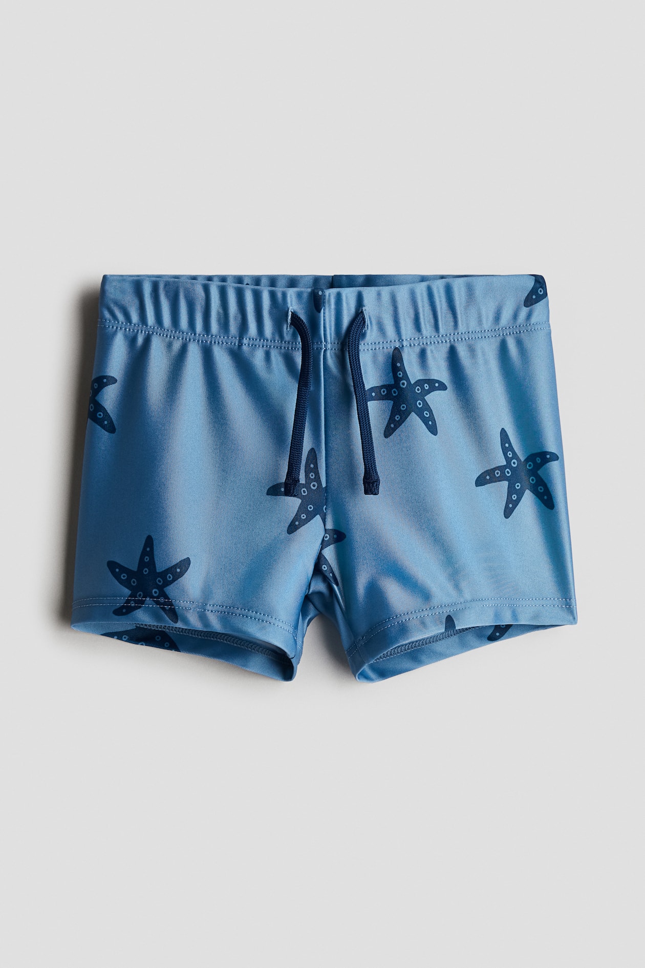 Blue/starfish Printed Swim Trunks for kids | H&M US