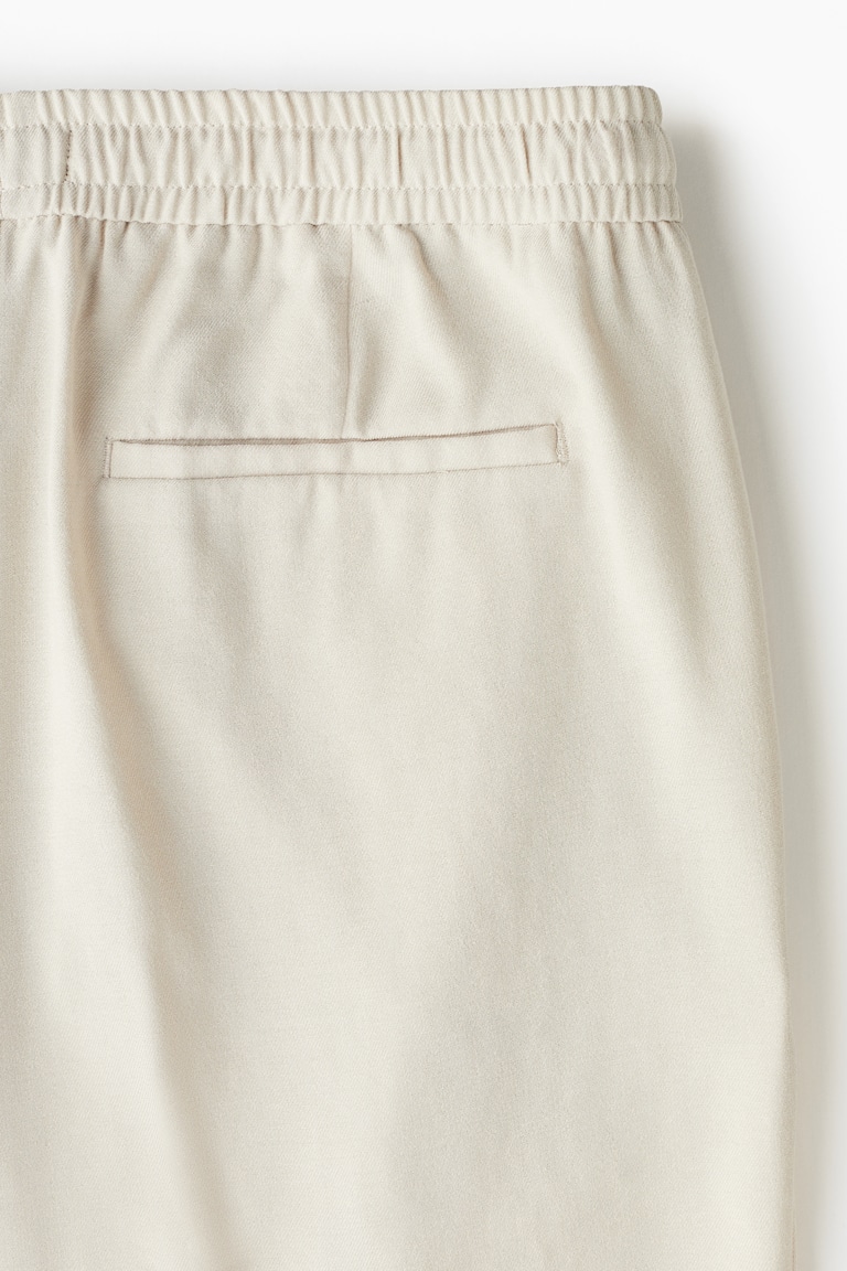 Regular Fit Creased Pants - Light beige - Men | H&M US