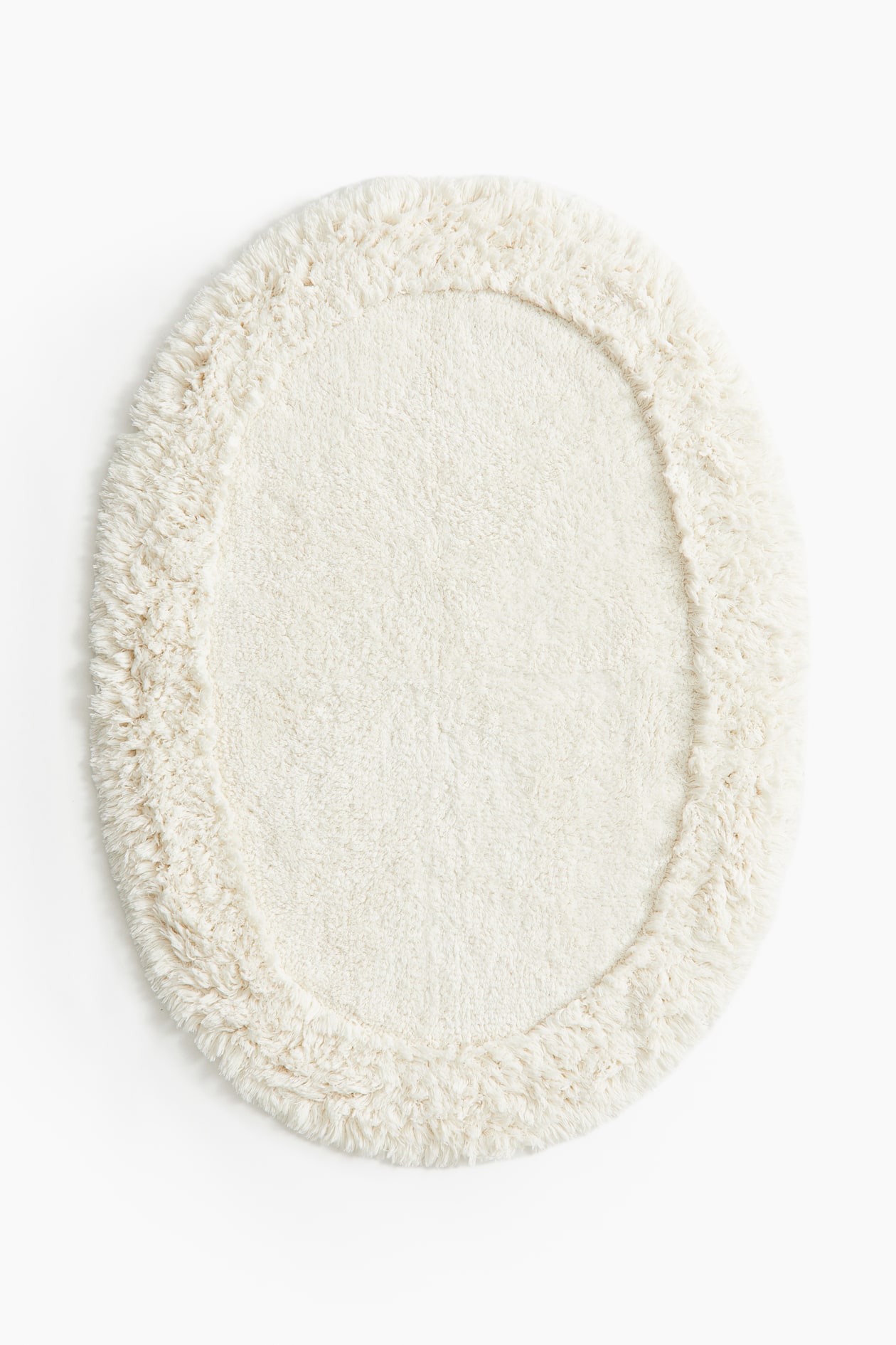 White Oval Tufted Bath Mat at H&M Home | H&M US