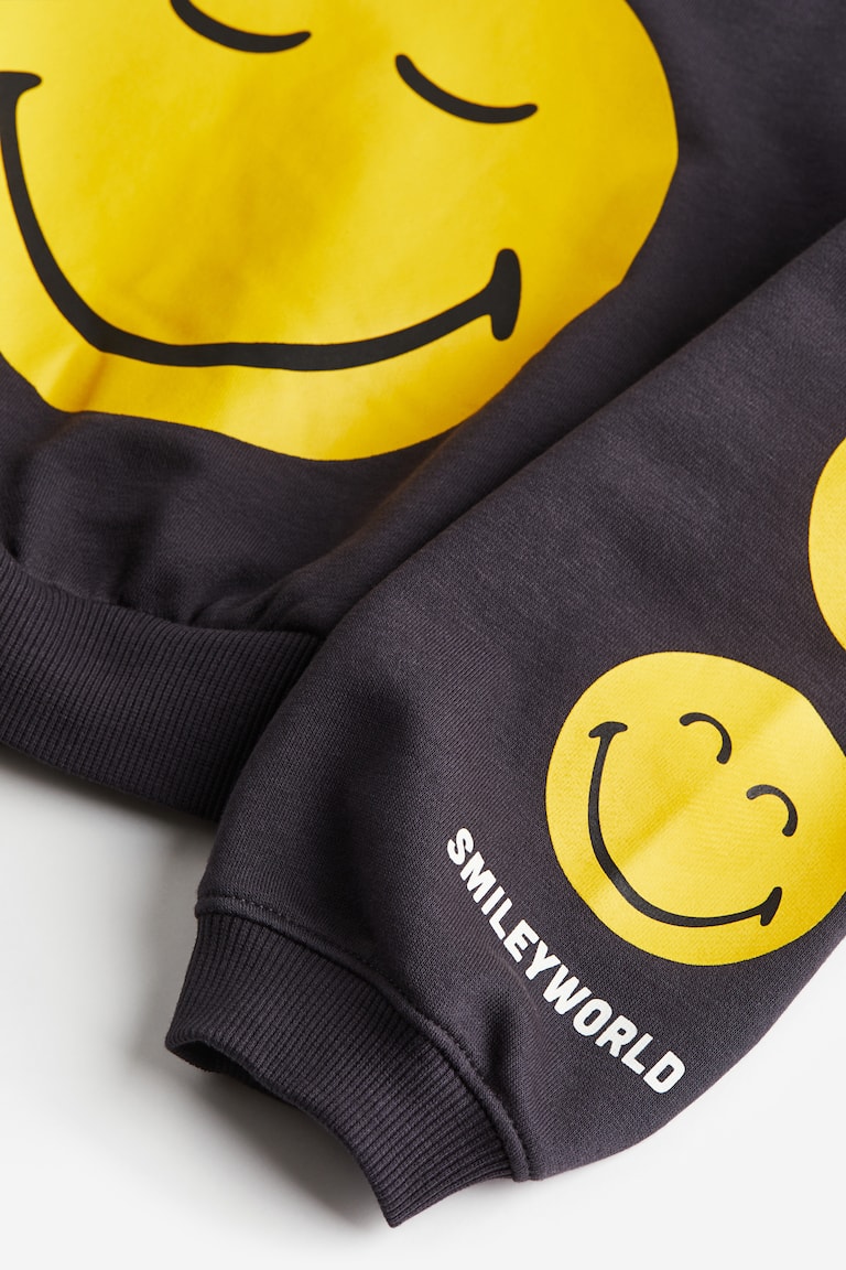 Dark grey/SmileyWorld® Oversized sweatshirt for kids | H&M MY
