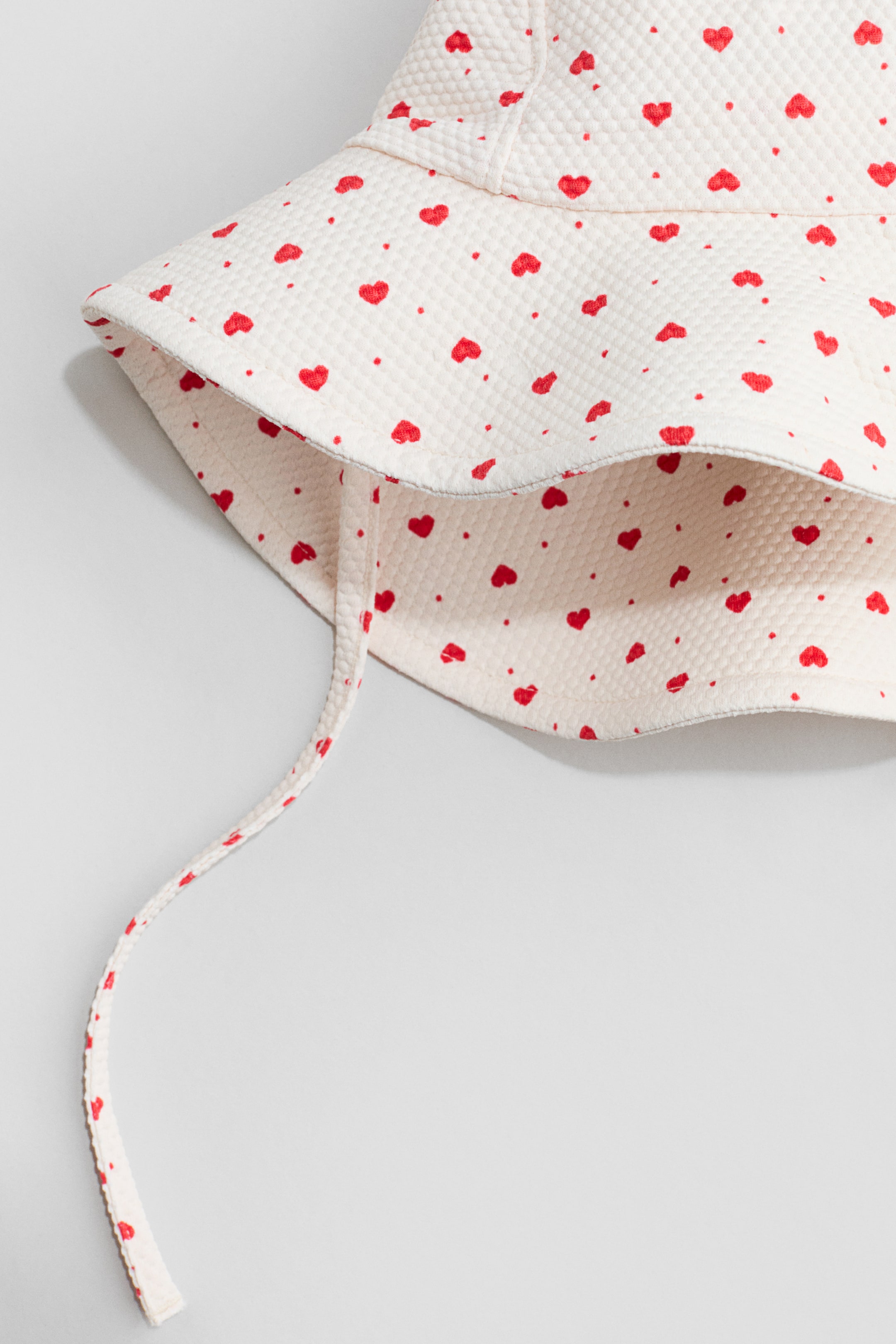 UPF 50 sun hat - Light beige/Hearts - Kids | H&M SG