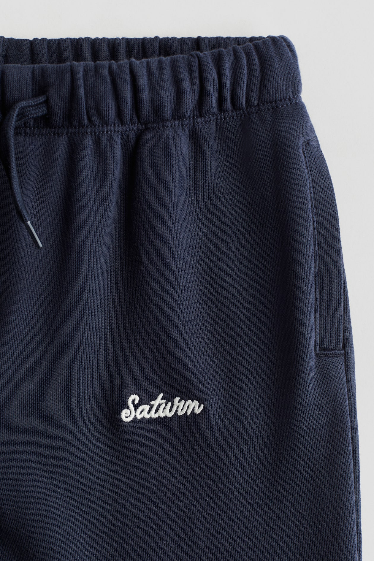 Embroidery-detail cotton joggers - Navy blue/Saturn - Kids | H&M GB