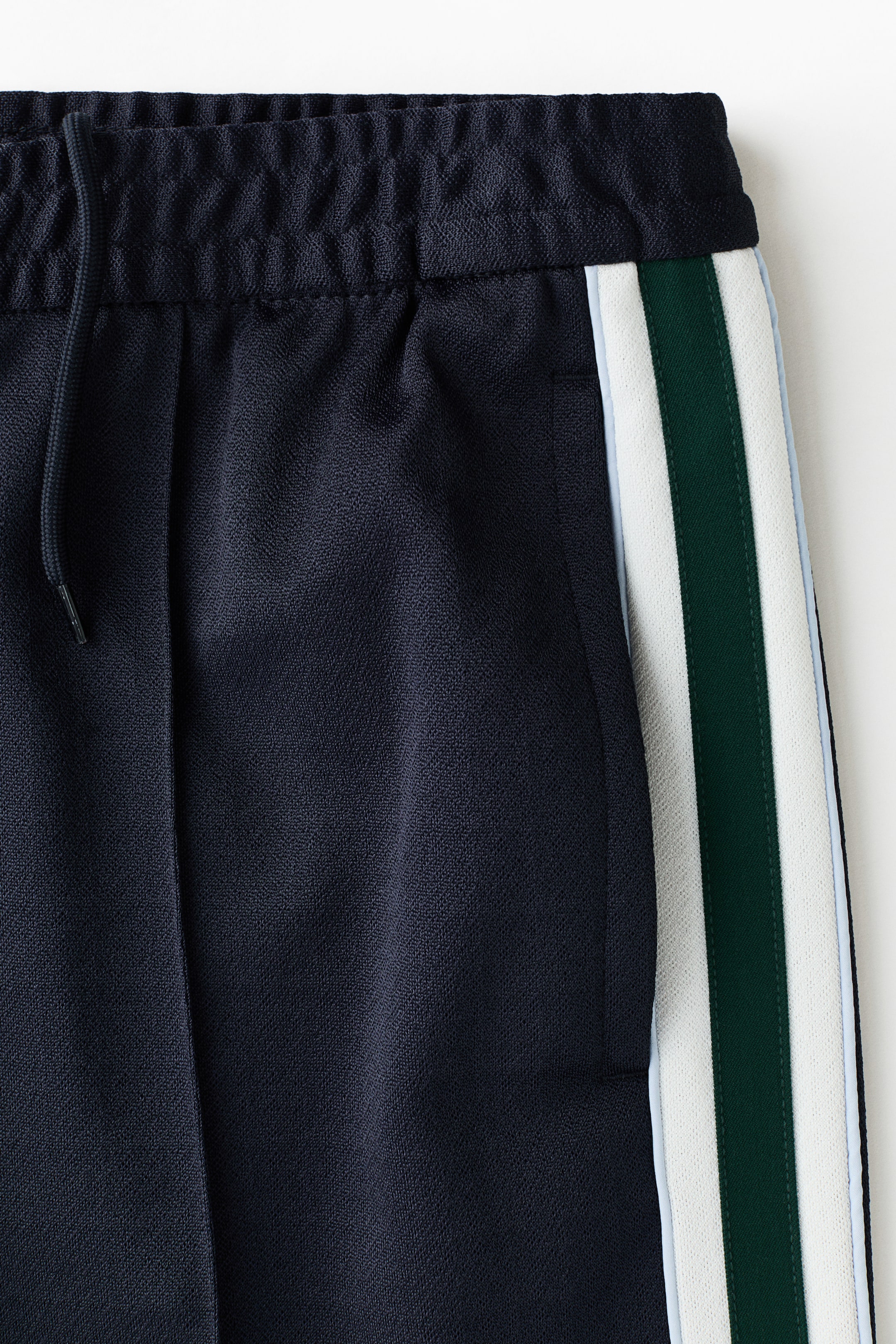 Men’s Navy blue/stripes Relaxed Fit track pants | H&M CA
