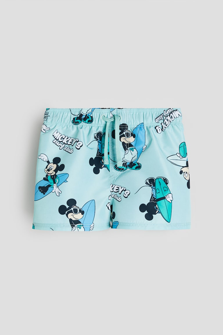 Turquoise/Mickey Mouse Patterned Swim Shorts for kids | H&M US