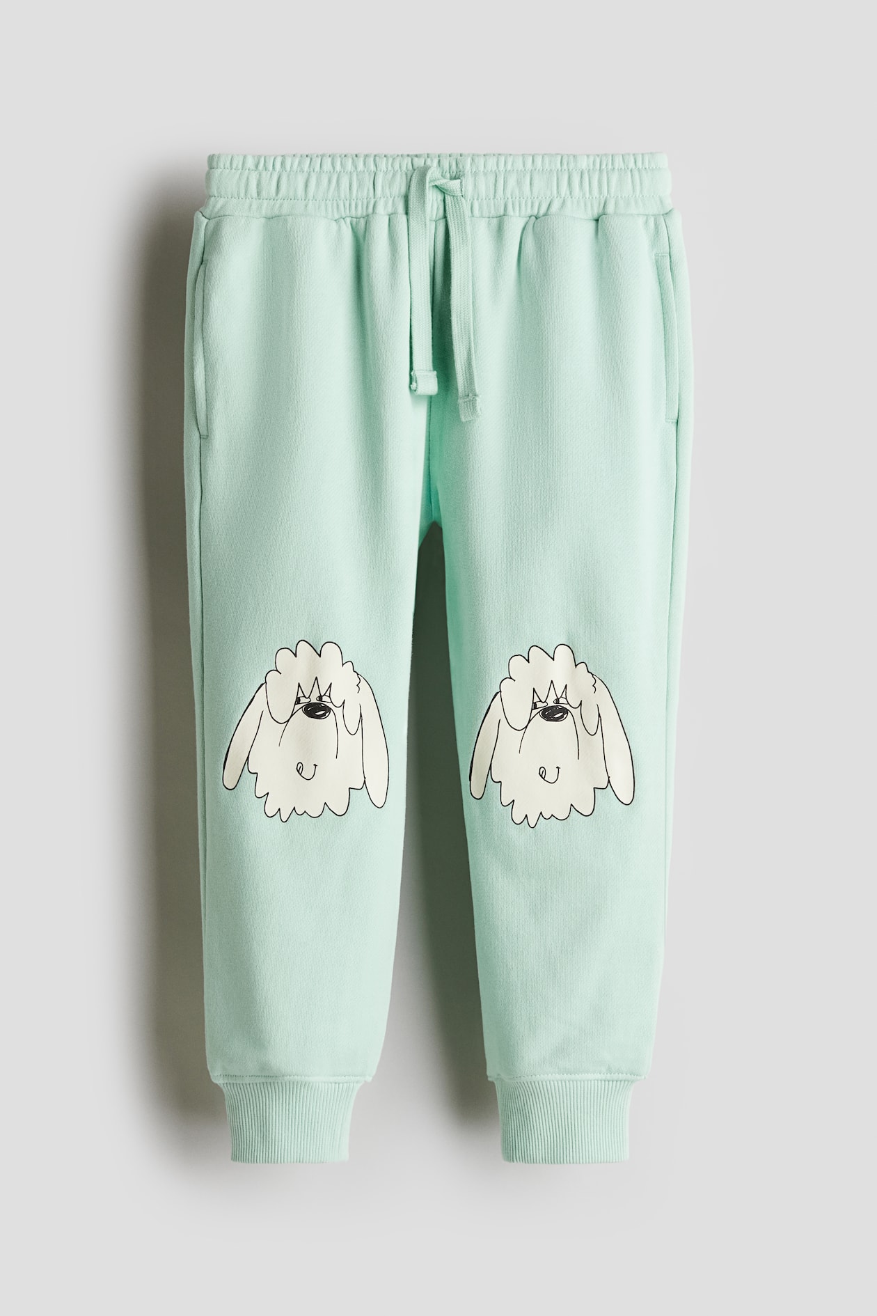 Joggers estampados de algodón - Verde claro/Perros - NIÑOS | H&M ES