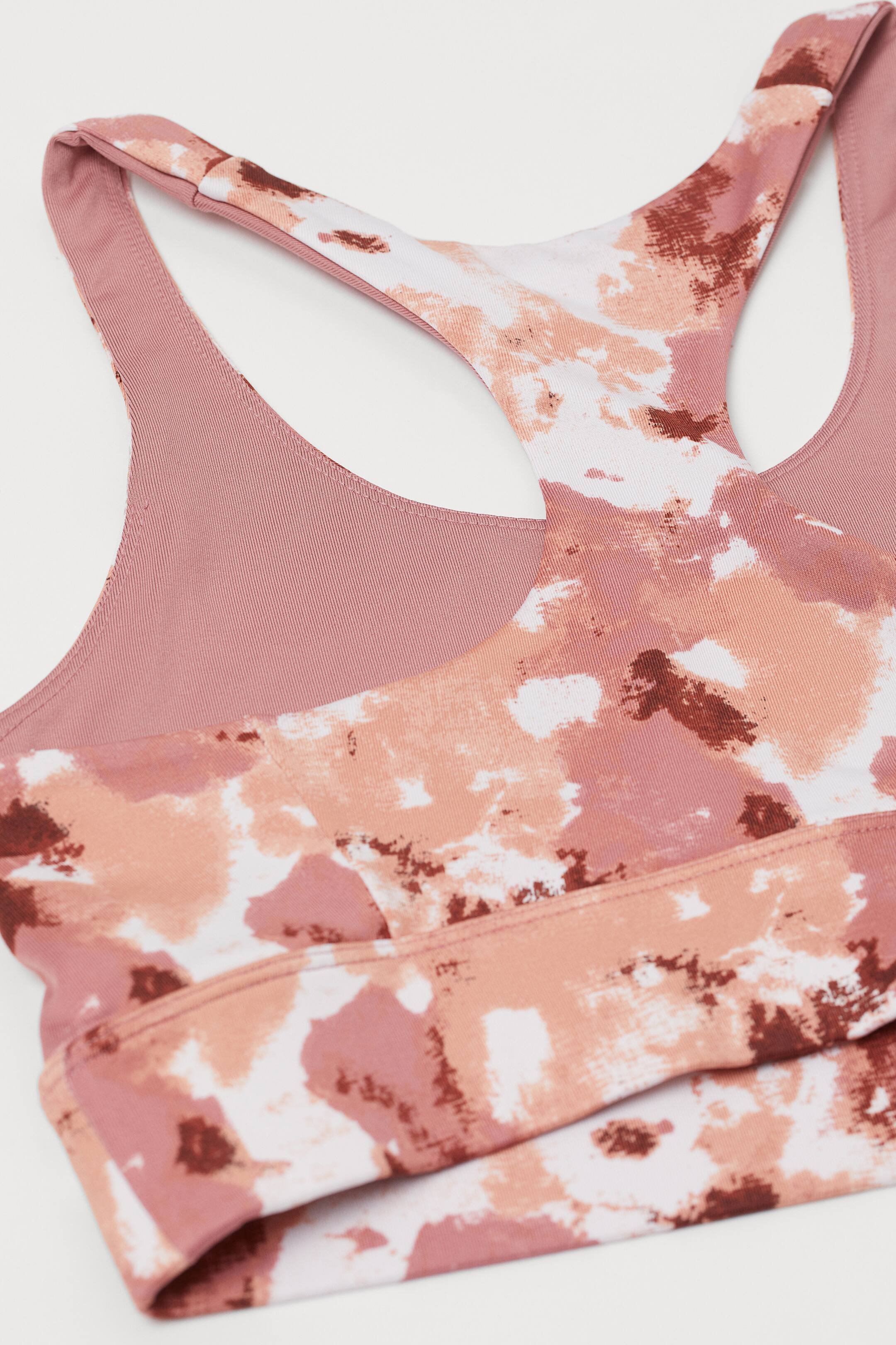 Top deportivo Medium support - Rosa palo/Estampado - Ladies | H&M MX