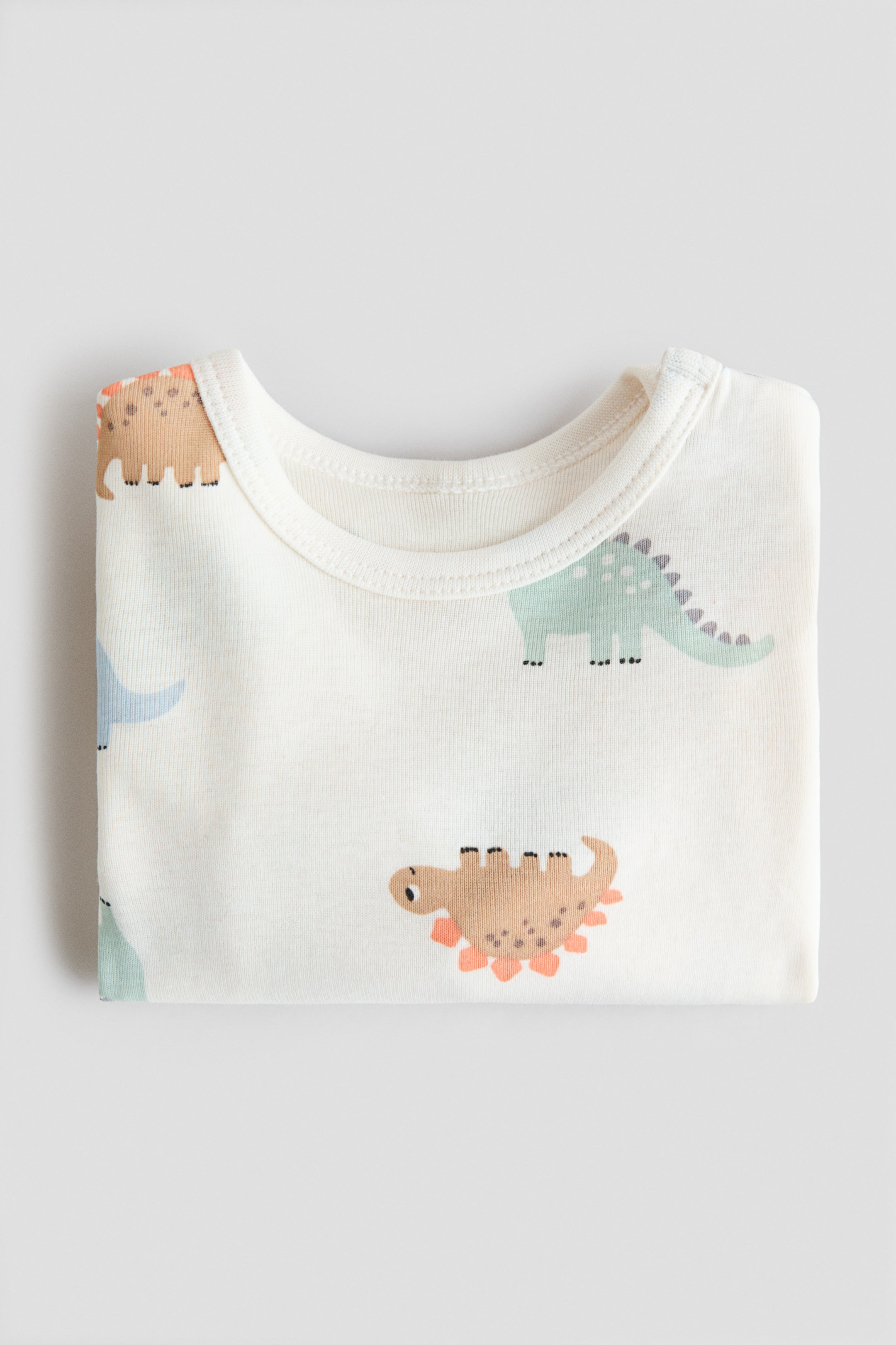 Printed cotton bodysuit - Crem/dinozauri - COPII | H&M RO