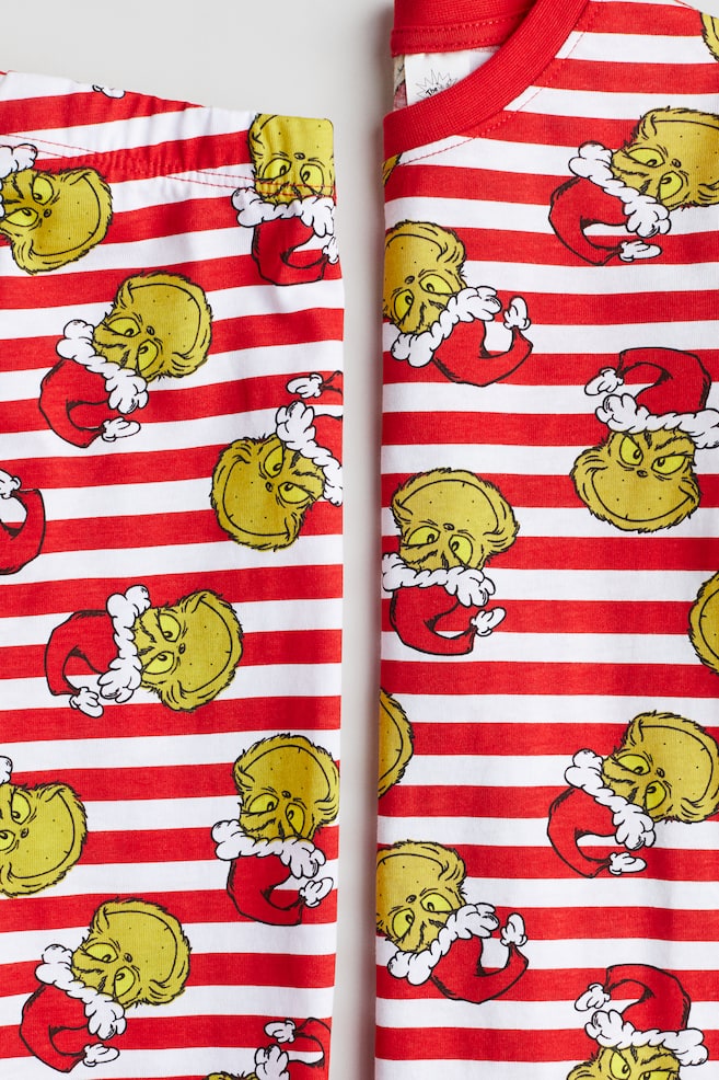 Pyjamas i bomullstrikå med tryck - Röd/Grinchen - BARN | H&M SE