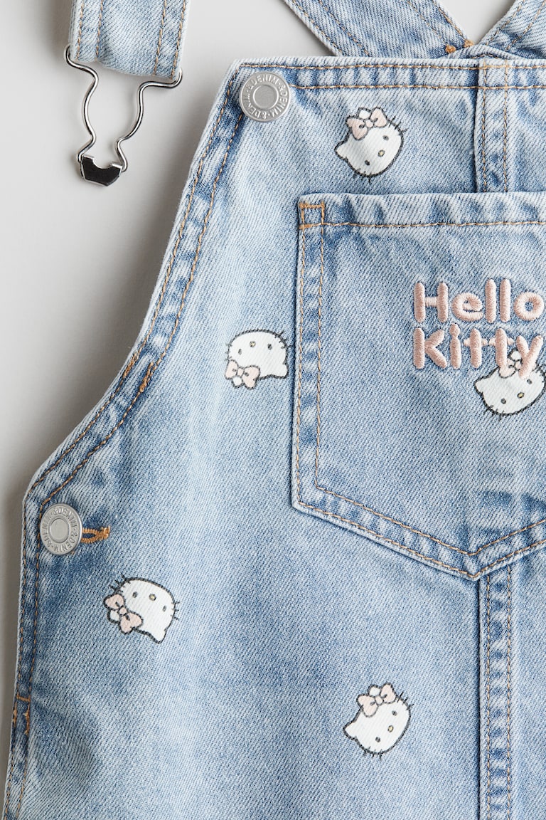 Printed Overall Dress - Light denim blue/Hello Kitty - Kids | H&M US