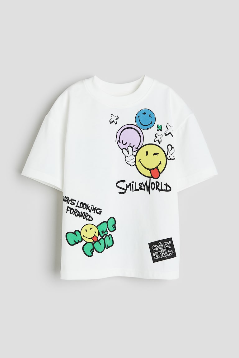 White/SmileyWorld® Oversized Printed T-Shirt for kids | H&M US