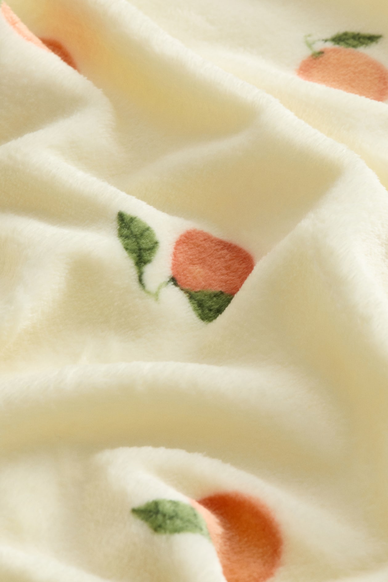 Light yellow/oranges Patterned Fleece Blanket at H&M Home | H&M US