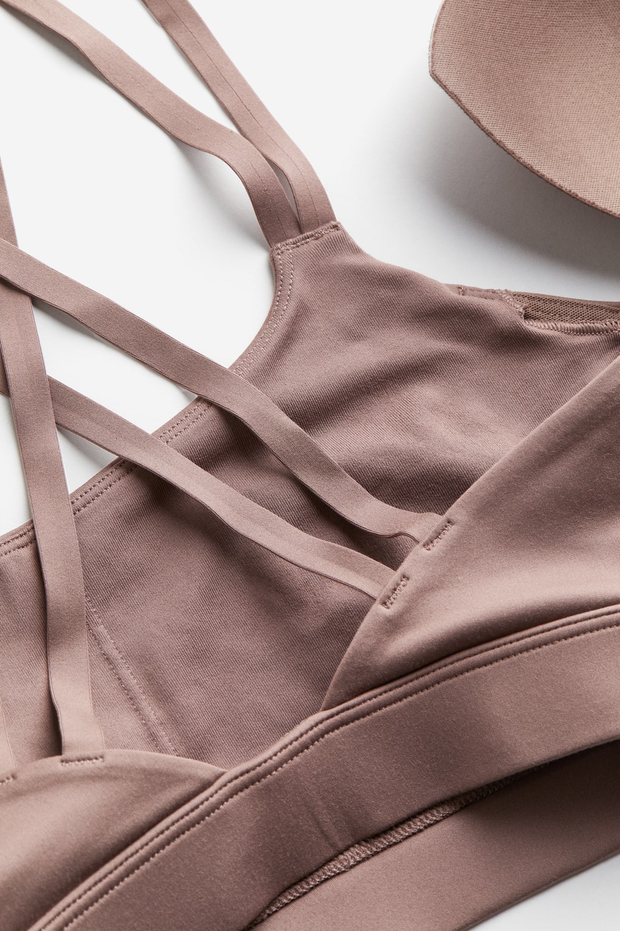 Light Support Sports bra in SoftMove™ - Dark beige - Ladies | H&M GB