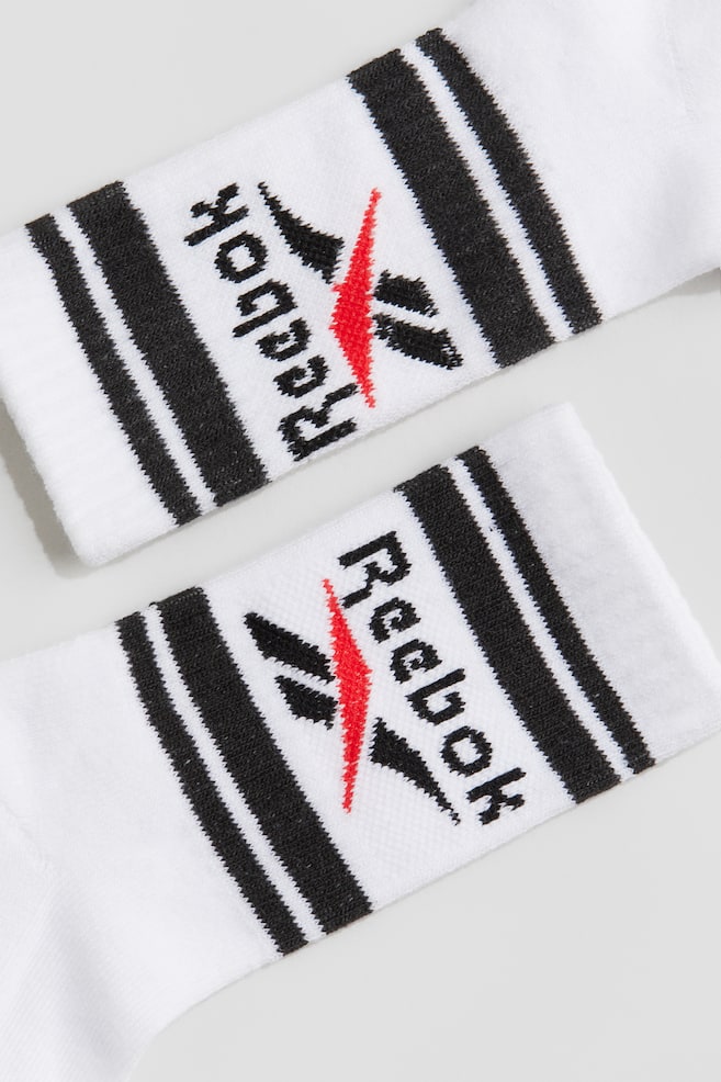2-pack motif-detail socks - White/Reebok - Kids | H&M GB