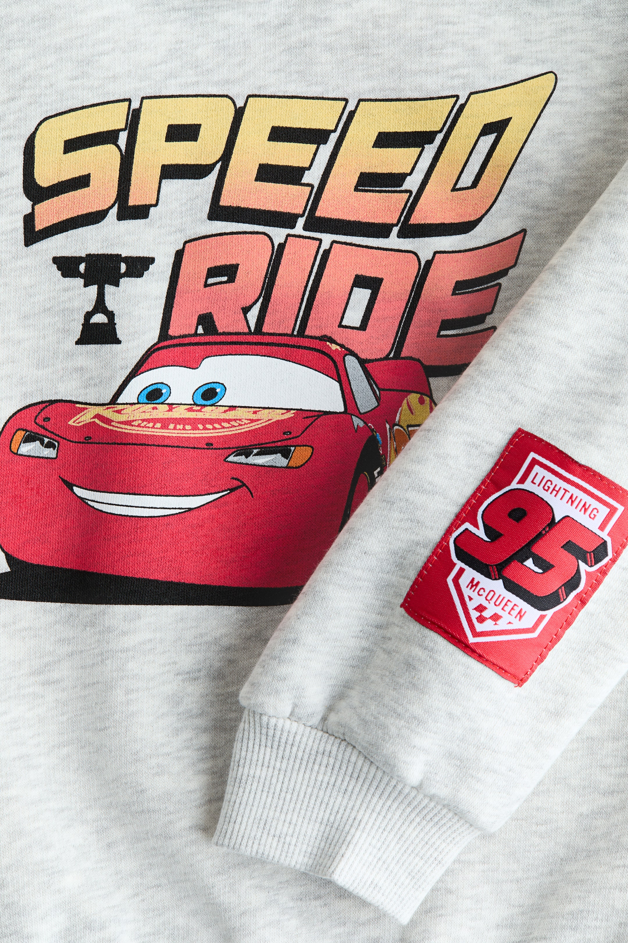 קפוצ'ון עם הדפס Loose Fit - אפור בהיר מלאנז'/מכוניות - Kids | H&M IL