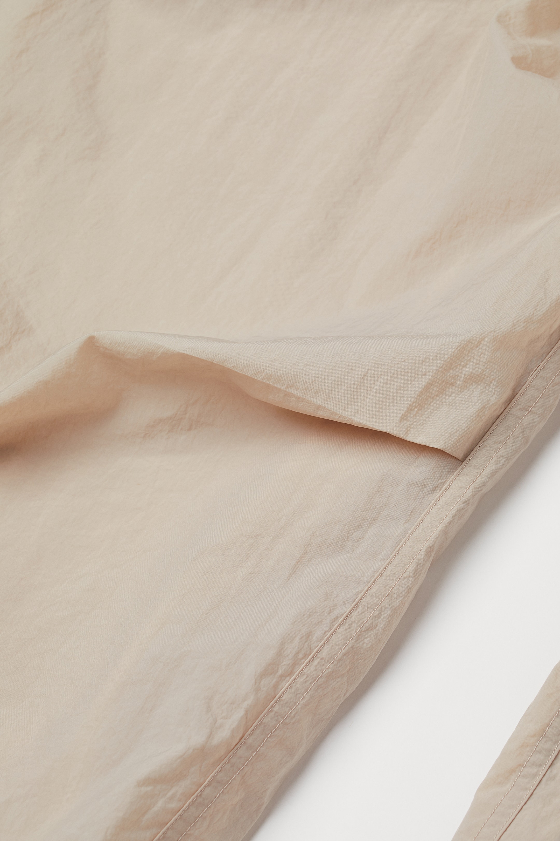 Recycled nylon trousers - Light greige - Men | H&M IE