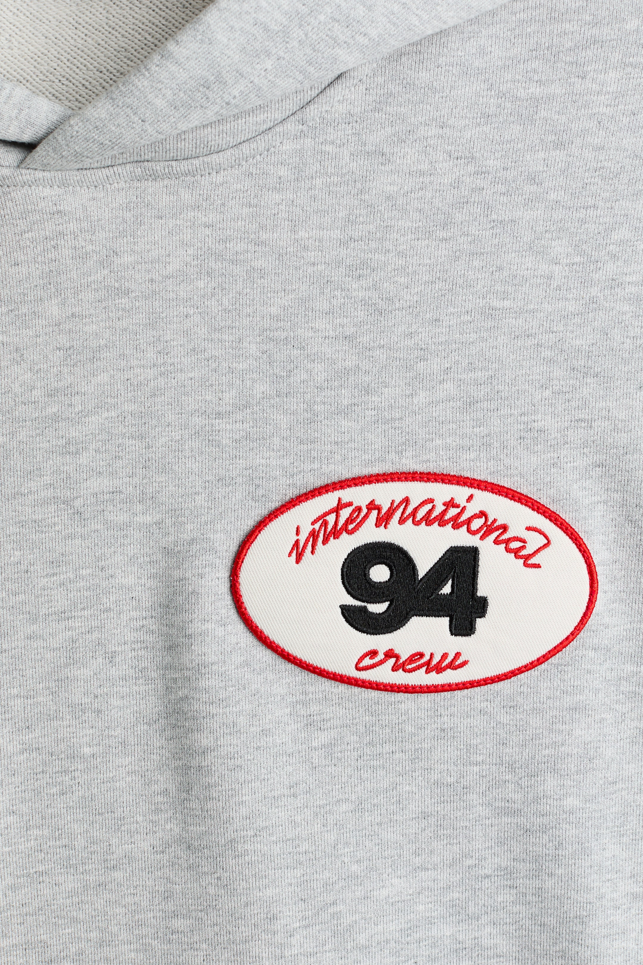 Men’s Gray melange/94 Loose-Fit Hoodie with Motif | H&M CA