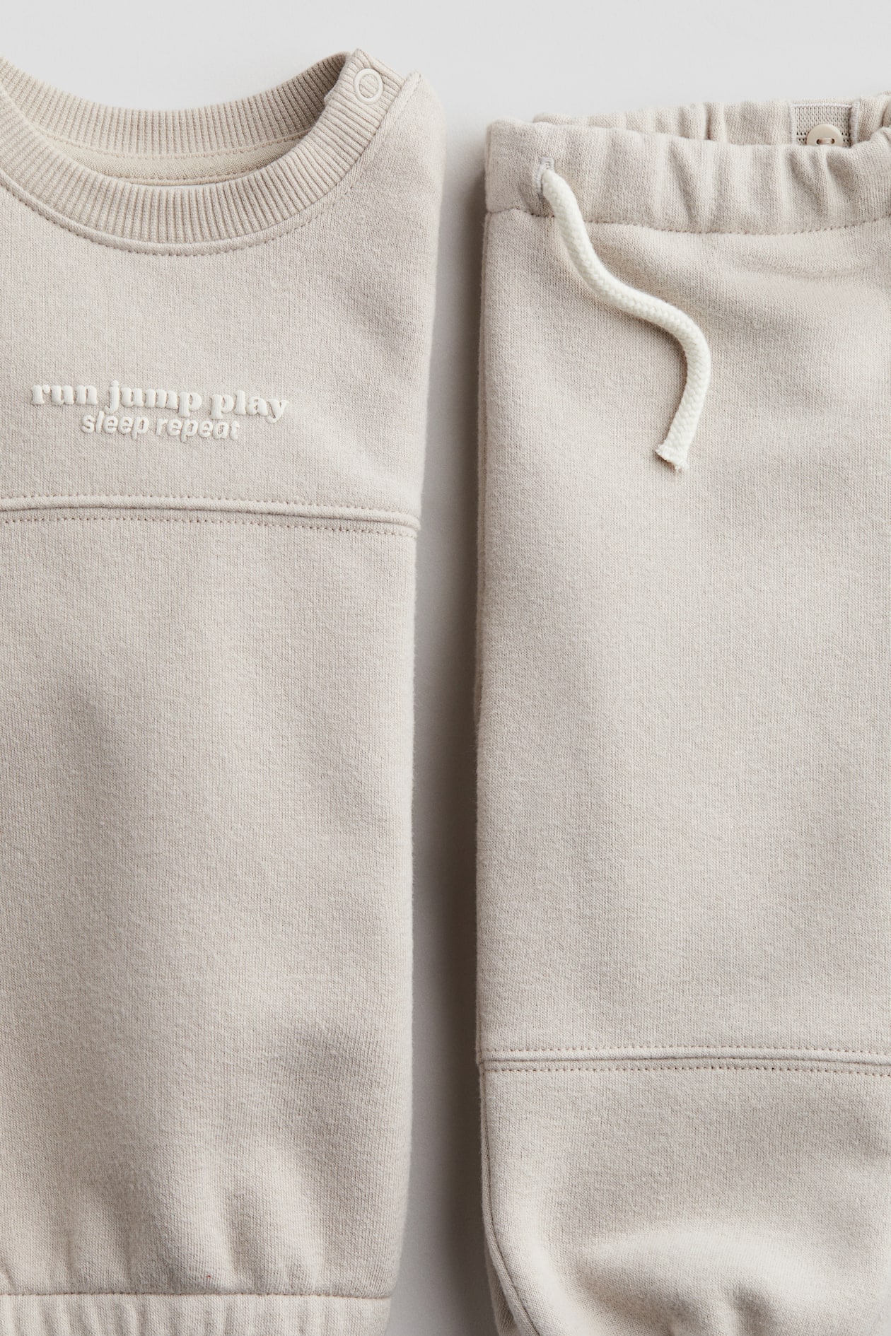 2-piece Sweatsuit - Light beige/Run Jump Play - Kids | H&M US