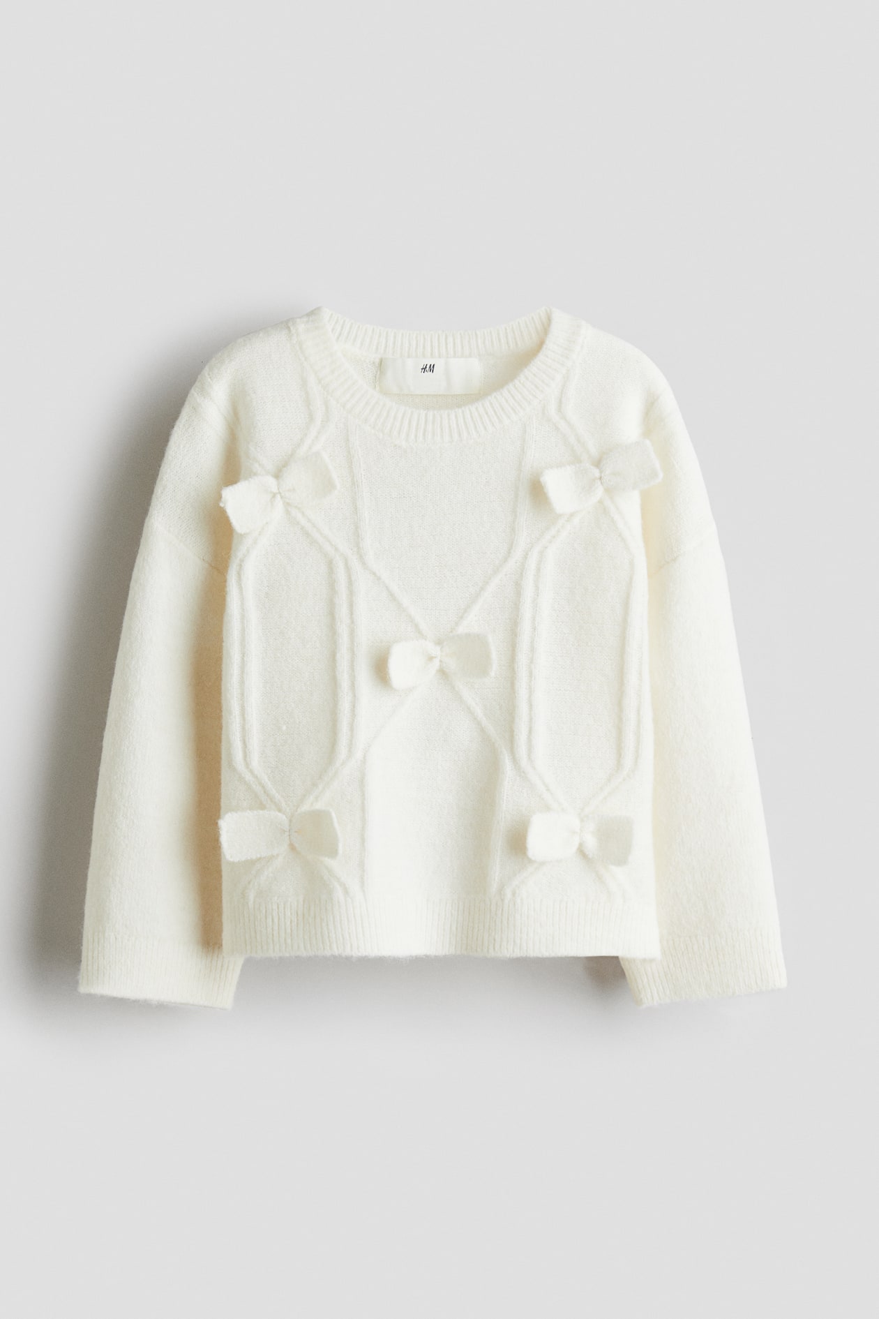 Suéter tejido con moños - Crema - Kids | H&M MX