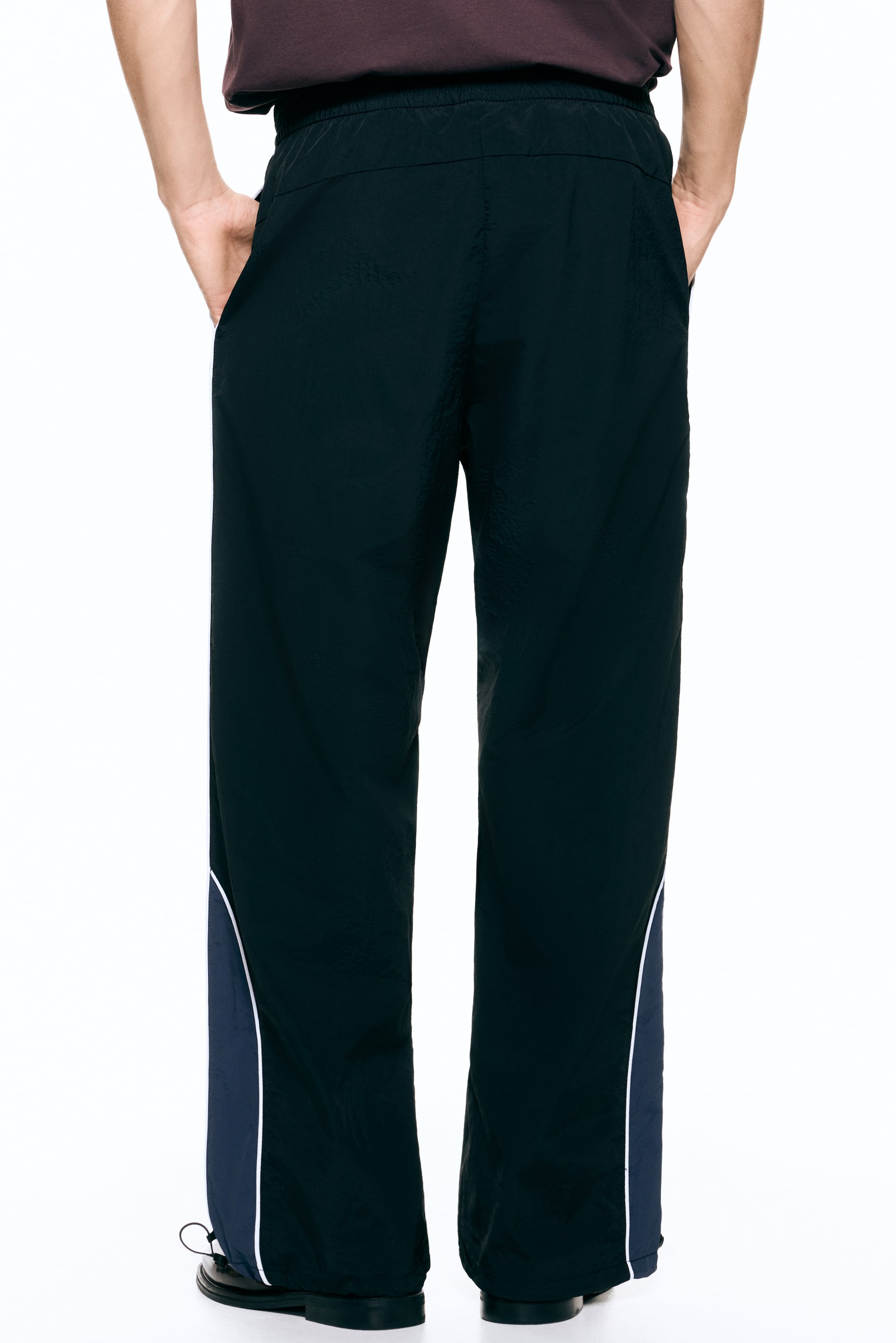 Men’s Black/Panels Loose Fit Nylon track pants | H&M SG