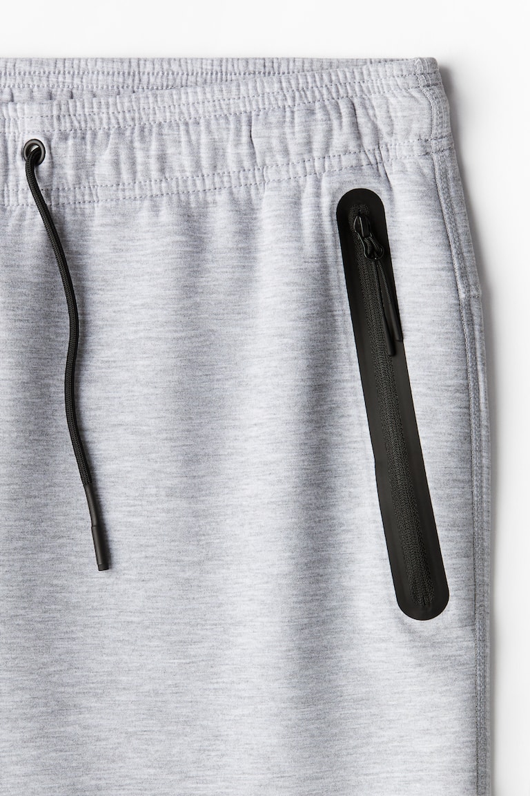 Men’s Light gray melange Slim-Fit Sports Joggers with DryMove™ | H&M US