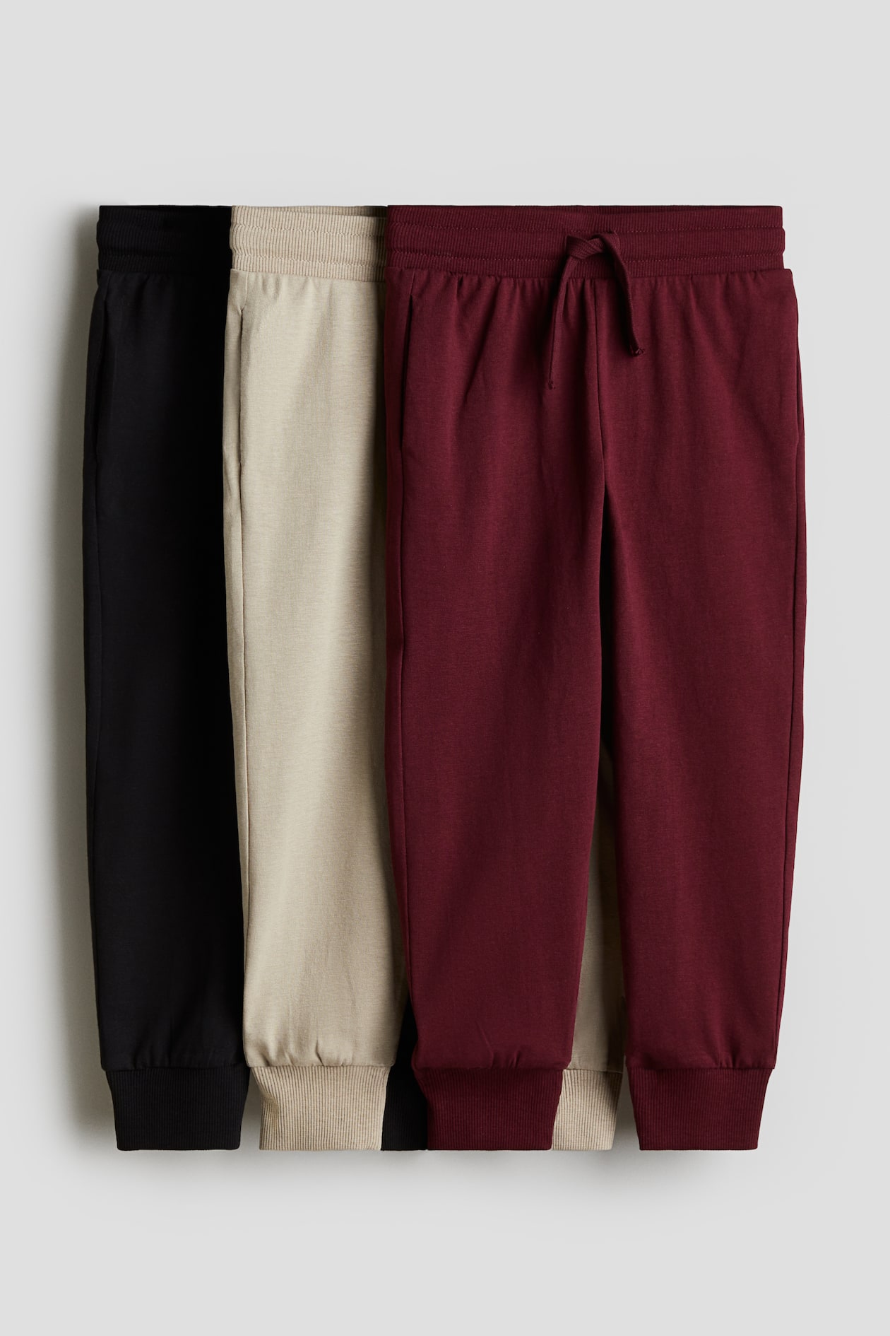 Pack de 3 joggers - Rojo oscuro/Beige claro - NIÑOS | H&M ES