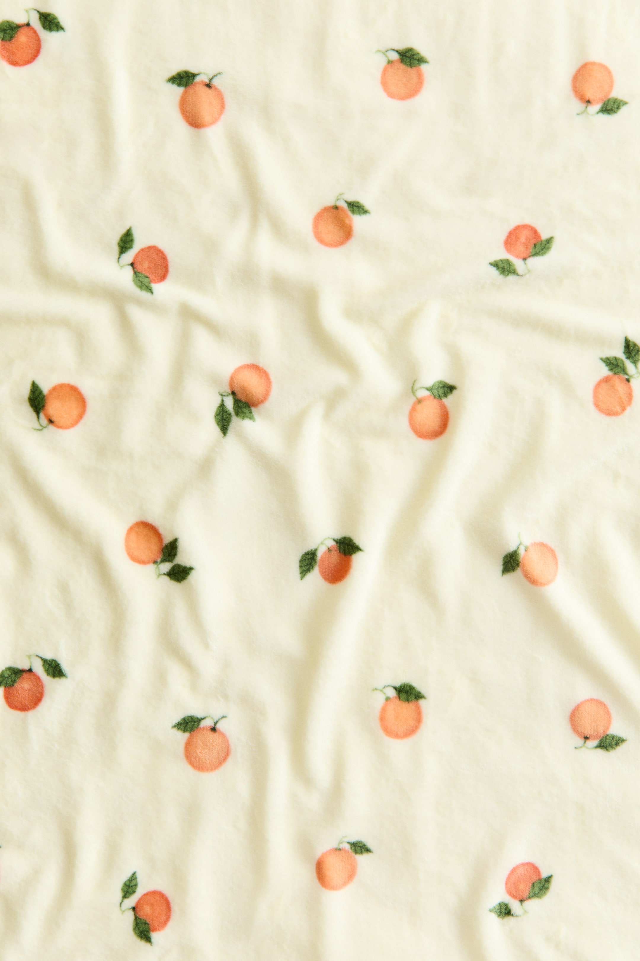 Light yellow/oranges Patterned Fleece Blanket at H&M Home | H&M US