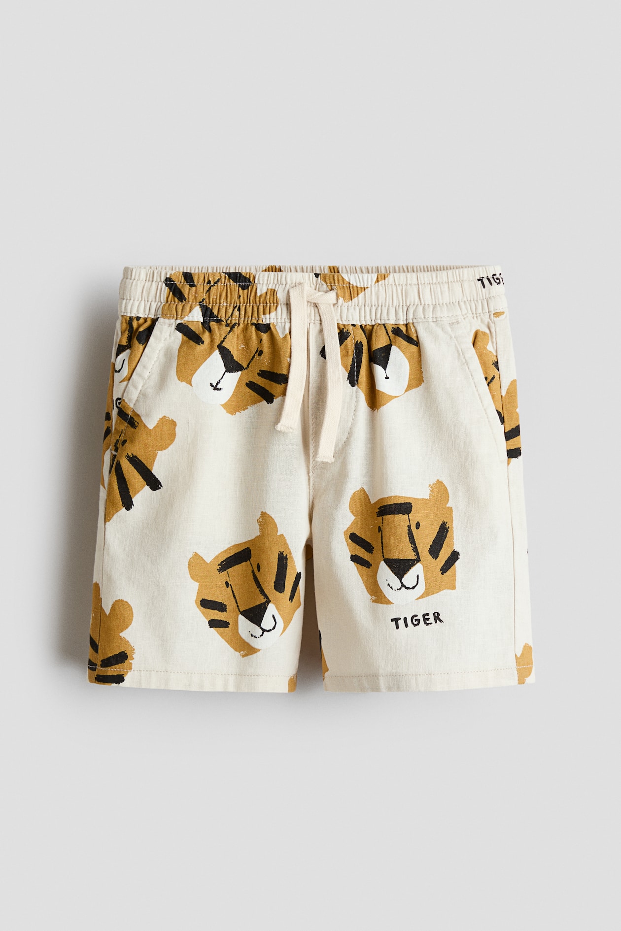 Linen-blend shorts - Light beige/Tigers - Kids | H&M MY