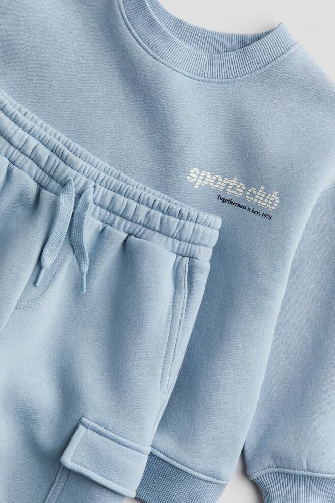 2-piece Sweatsuit - Light blue/Sports Club - Kids | H&M US