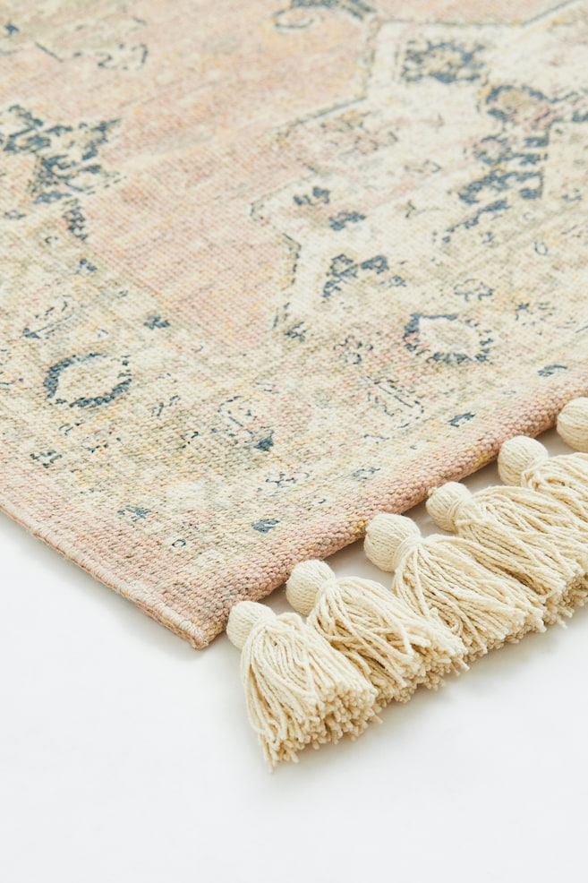 Powder pink/patterned Patterned Rug with Fringe at H&M Home | H&M CA