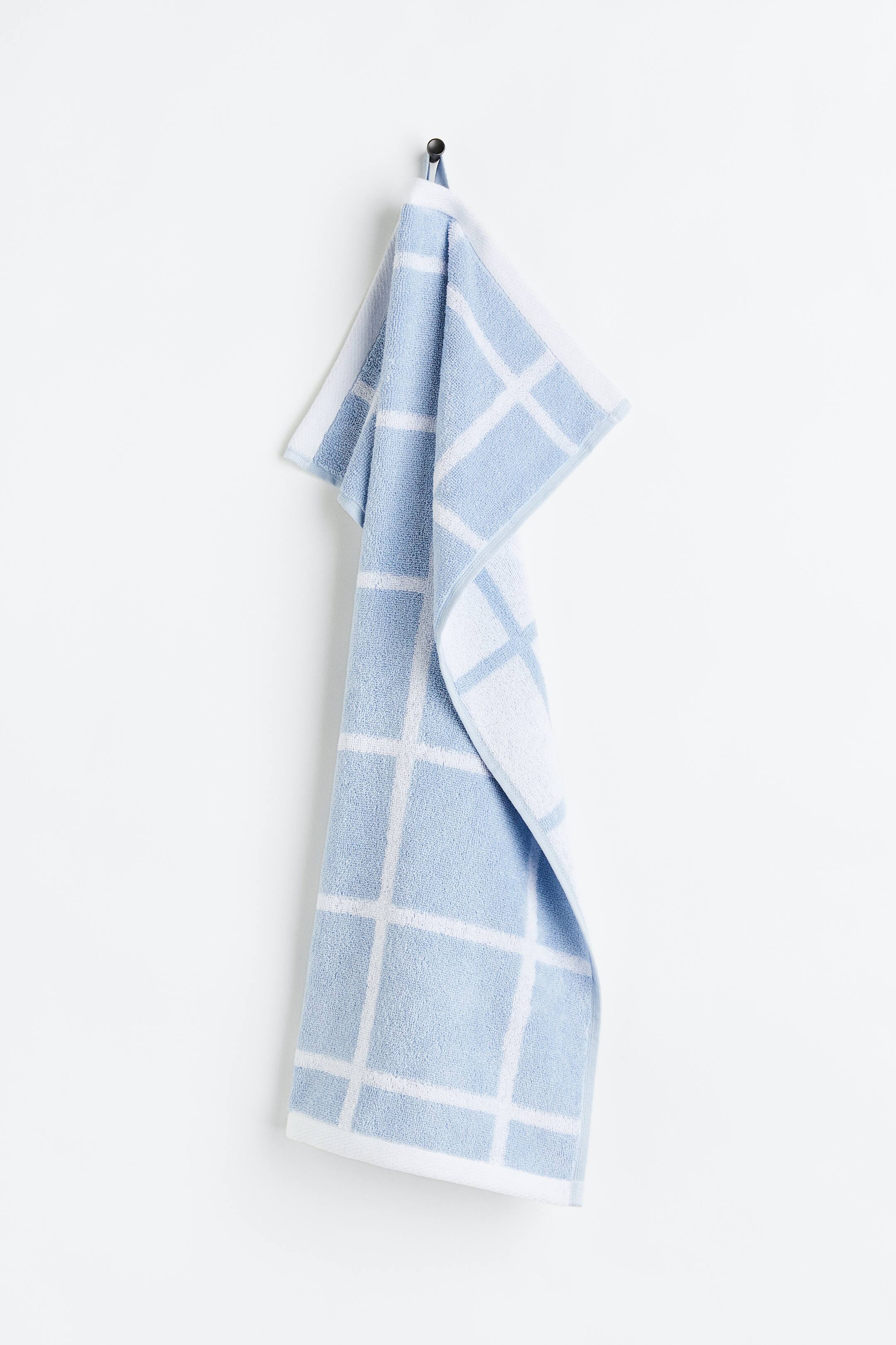Light blue/Checked Checked hand towel at H&M Home | H&M IN