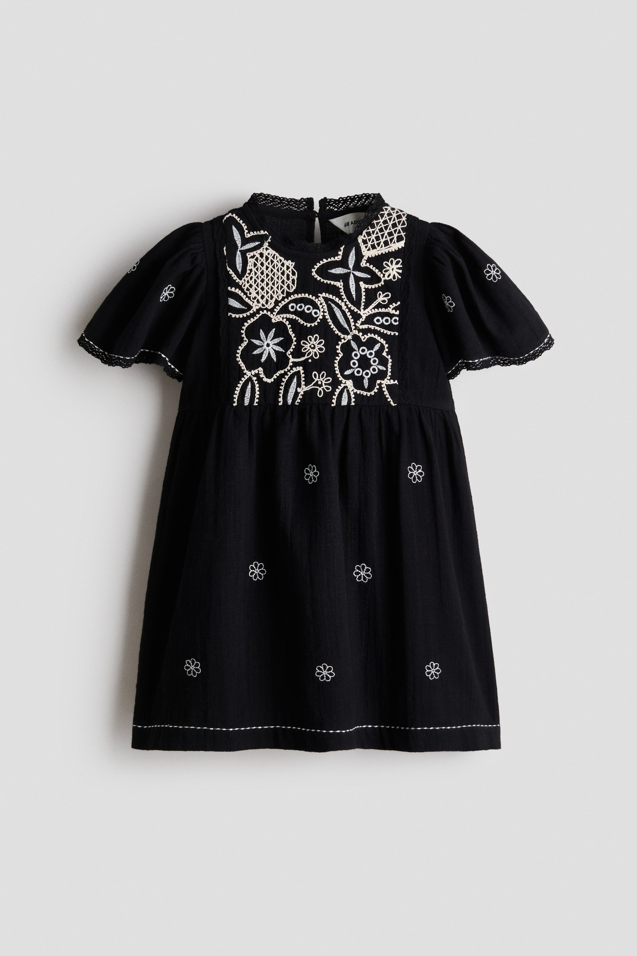 Abito in cotone con ricamo - Nero/fiori - BAMBINO | H&M IT